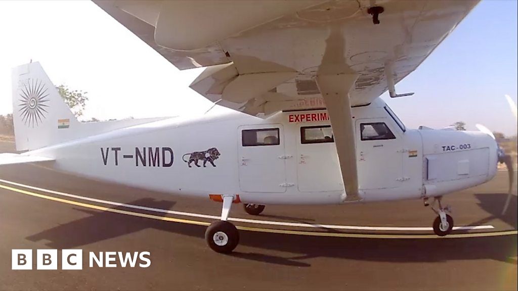 Plane built on Mumbai rooftop takes to the skies - BBC News