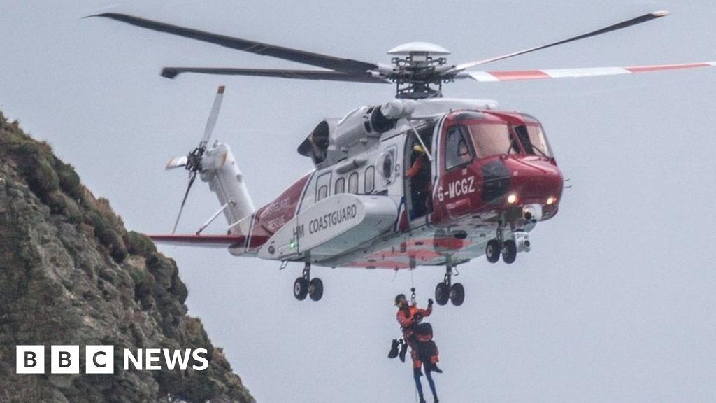 Stranded surfers airlifted to safety - BBC News
