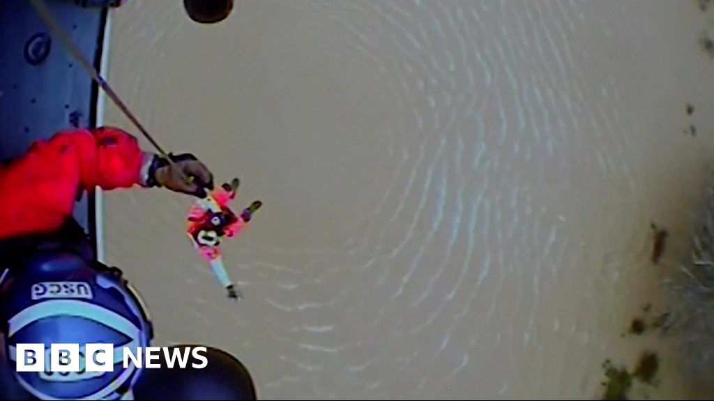 Video shows dramatic water rescues from US floods - BBC News