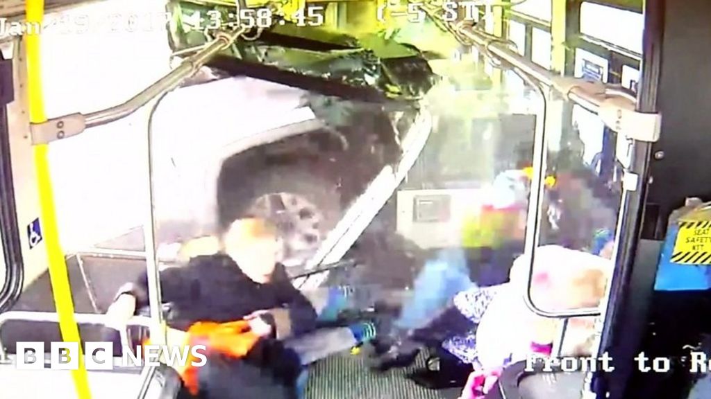 Truck crashing through bus captured on camera in New York - BBC News