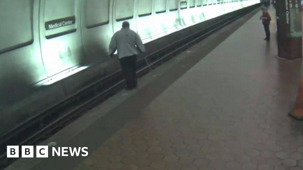 Visually impaired man rescued from oncoming train by passengers - BBC News