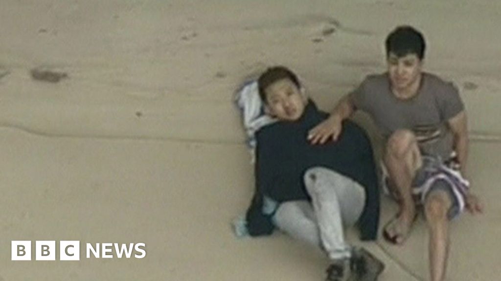 Footage shows moment two men are rescued from Australian rock face ...