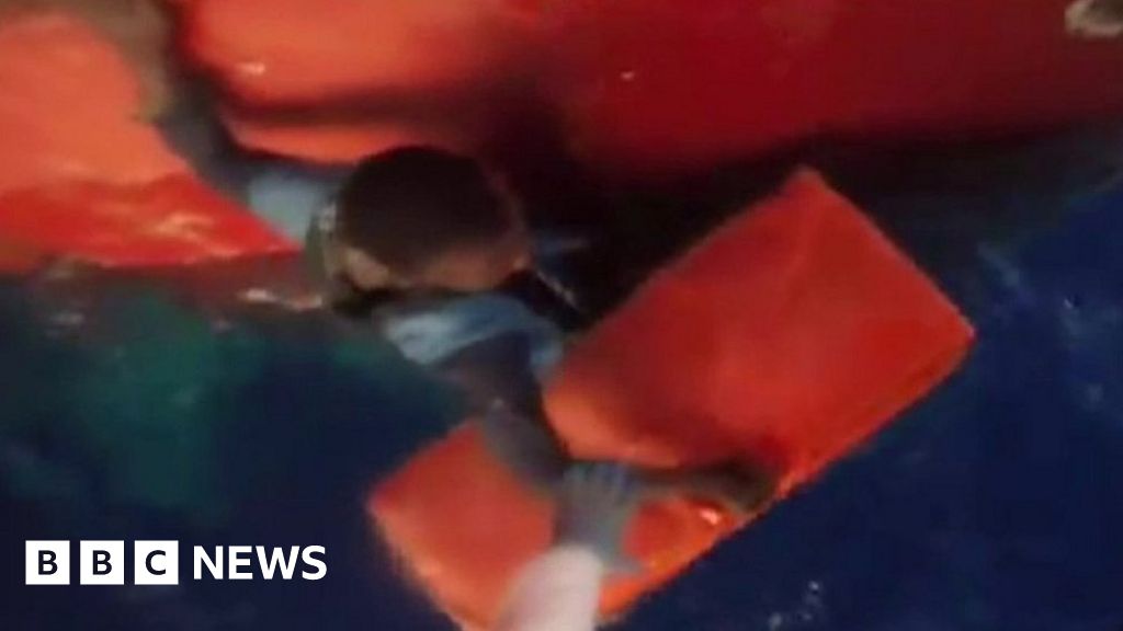 Migrant rescued from ship's rudder by Italy coastguard - BBC News