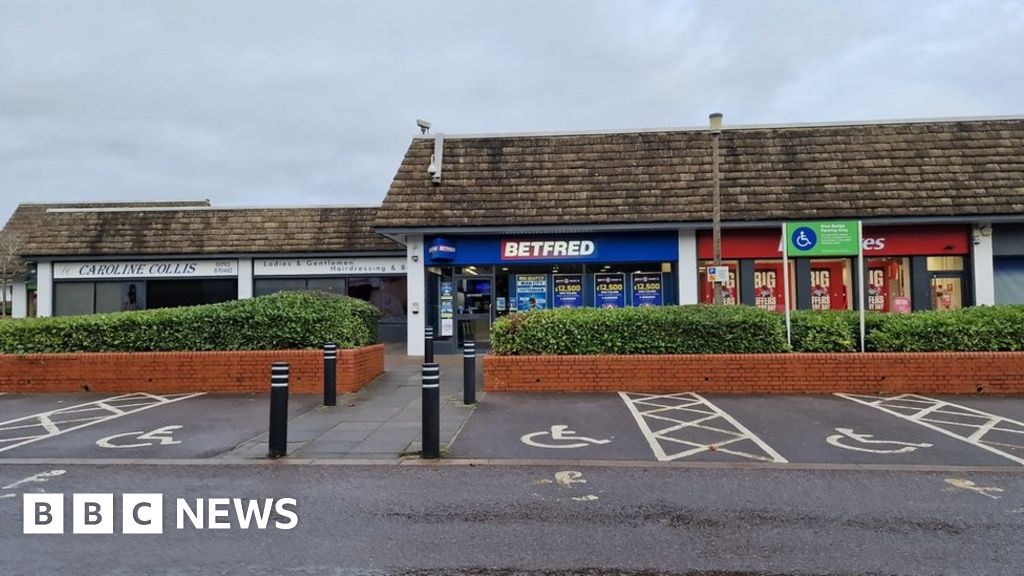 Swindon betting shop cashier robbed at knifepoint by masked men