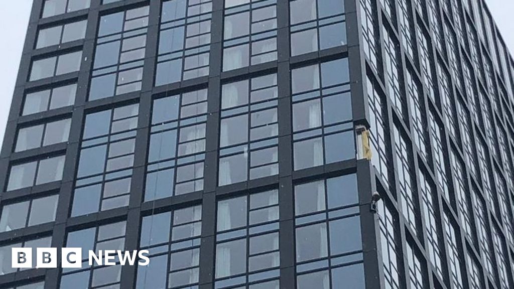 Probe launched after panels fall from Manchester tower block