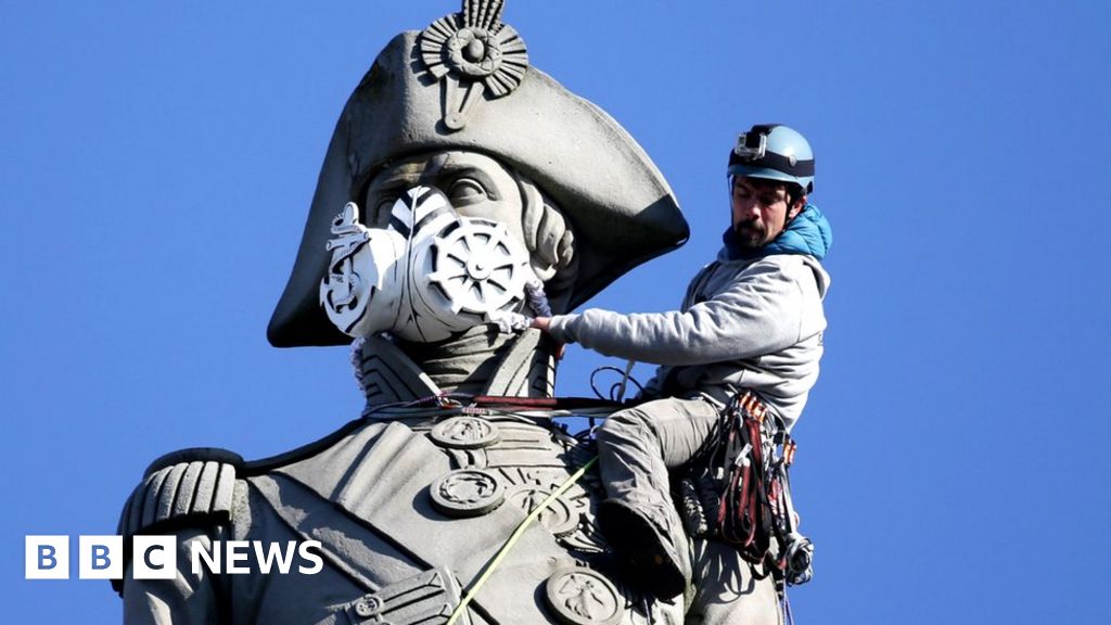 Eight arrests after Greenpeace protesters scale London monuments - BBC News