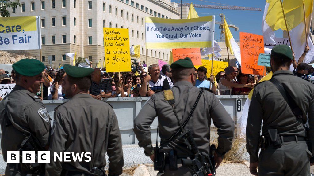 Protesters rally over funding for Christian schools in Israel - BBC News