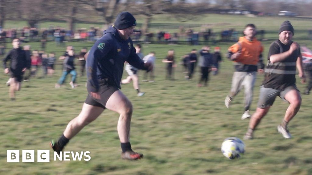 Hundreds turn out for ancient Alnwick Shrovetide game - BBC News
