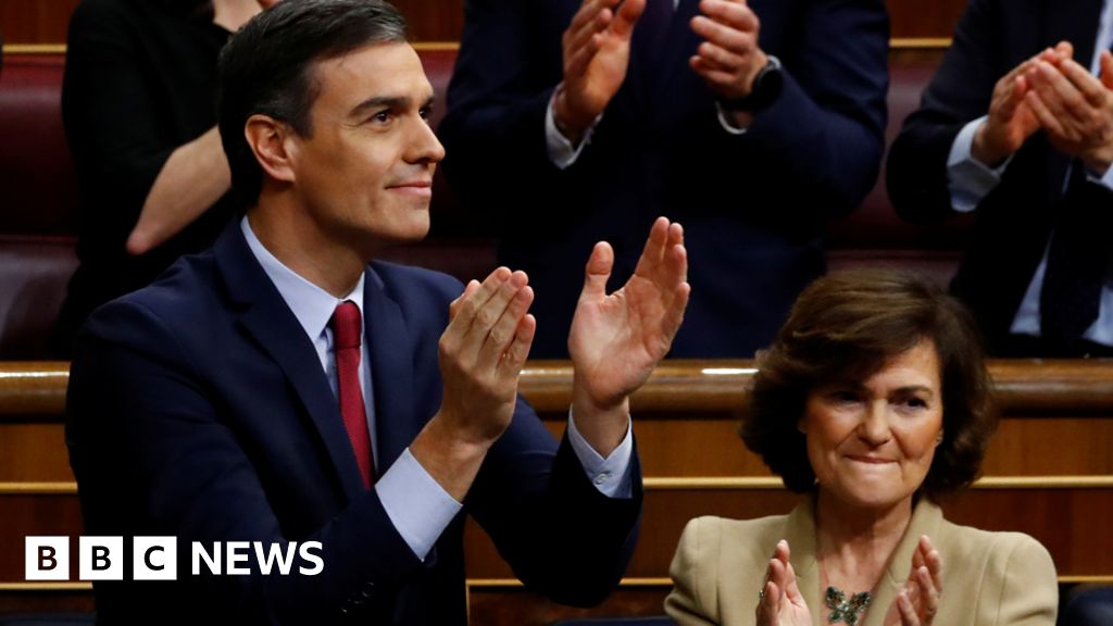 Spain's Sánchez narrowly wins vote to govern in coalition - BBC News