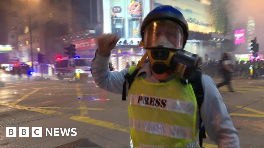 Hong Kong protests: Riot police charge and fire tear gas