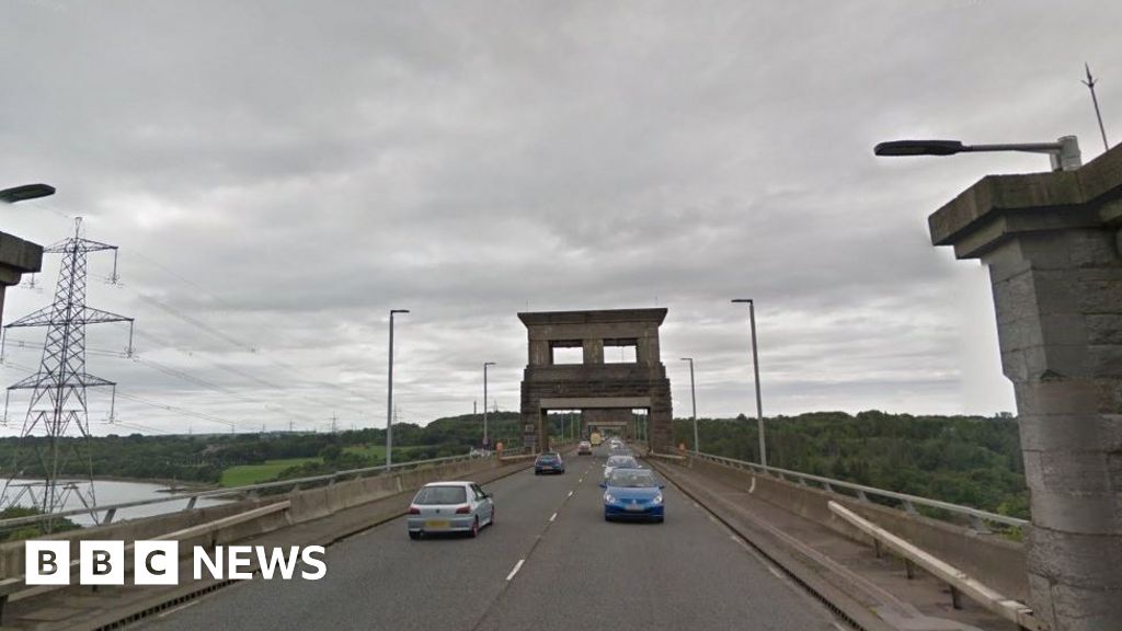 Man cut free from car crash on Britannia Bridge dies - BBC News