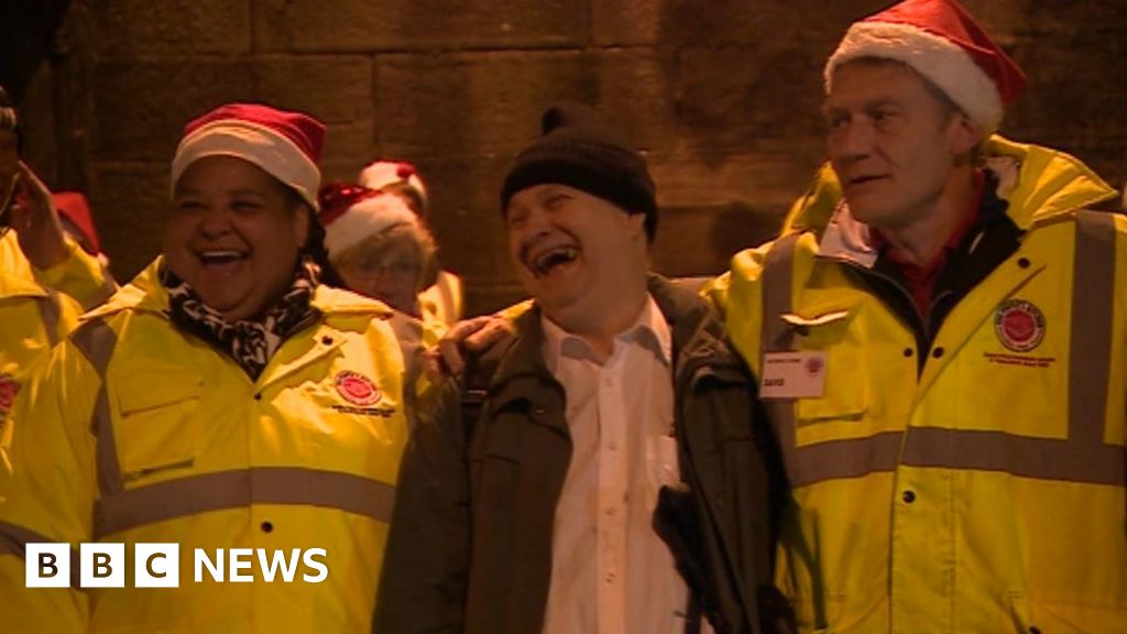 Homeless people in Newcastle enjoy a Christmas street party - BBC News