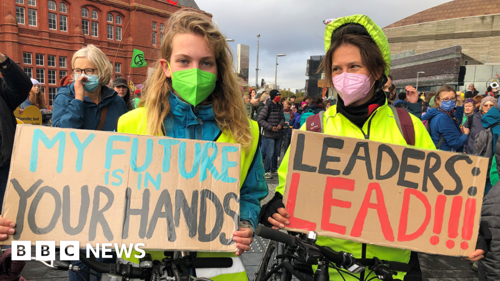 Climate change protesters and sports fans descend on Cardiff - BBC News