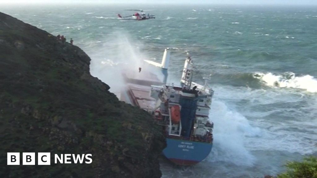 Sardinia dramatic storm rescue as cargo ship hits cliff - BBC News
