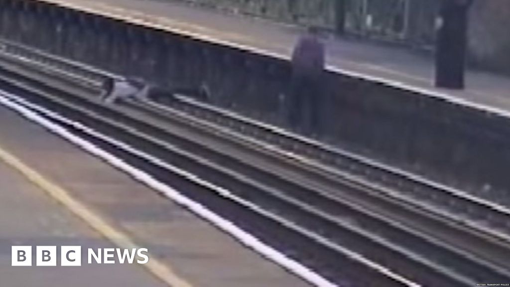 Woolston station CCTV footage of man on 'live' rail issued - BBC News