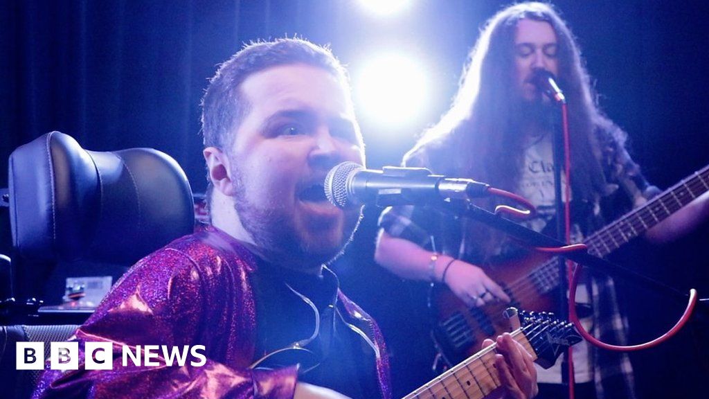 Electric wheelchair frontman campaigns for disabled musicians - BBC News