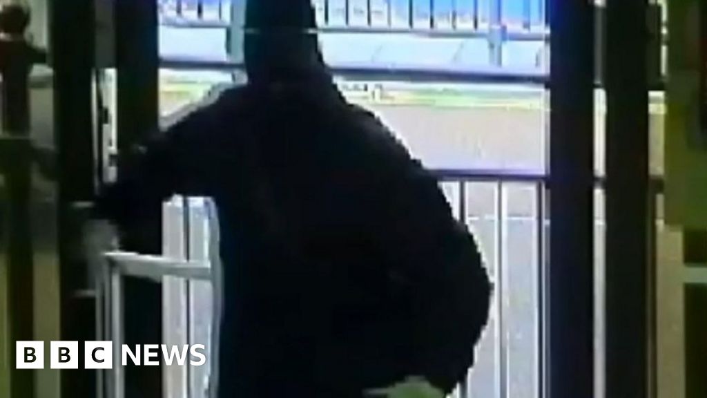 CCTV footage of masked 'crowbar-wielding' bank robbers - BBC News