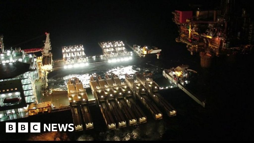 Brent Delta platform in North Sea removed from legs - BBC News