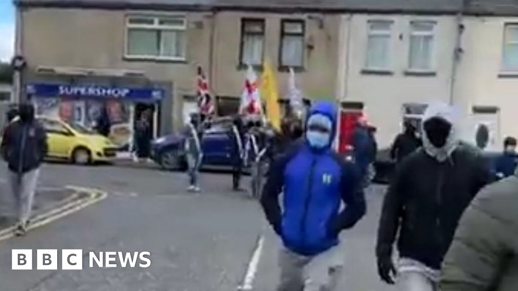 Portadown parade involving masked men investigated - BBC News