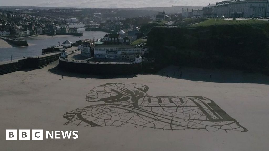 Giant Whitby sand portrait highlights climate change - BBC News
