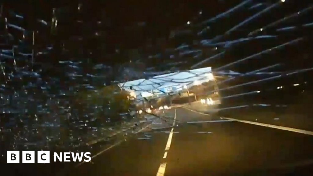 Moment stone-throwing thug shatters car windscreen on motorway