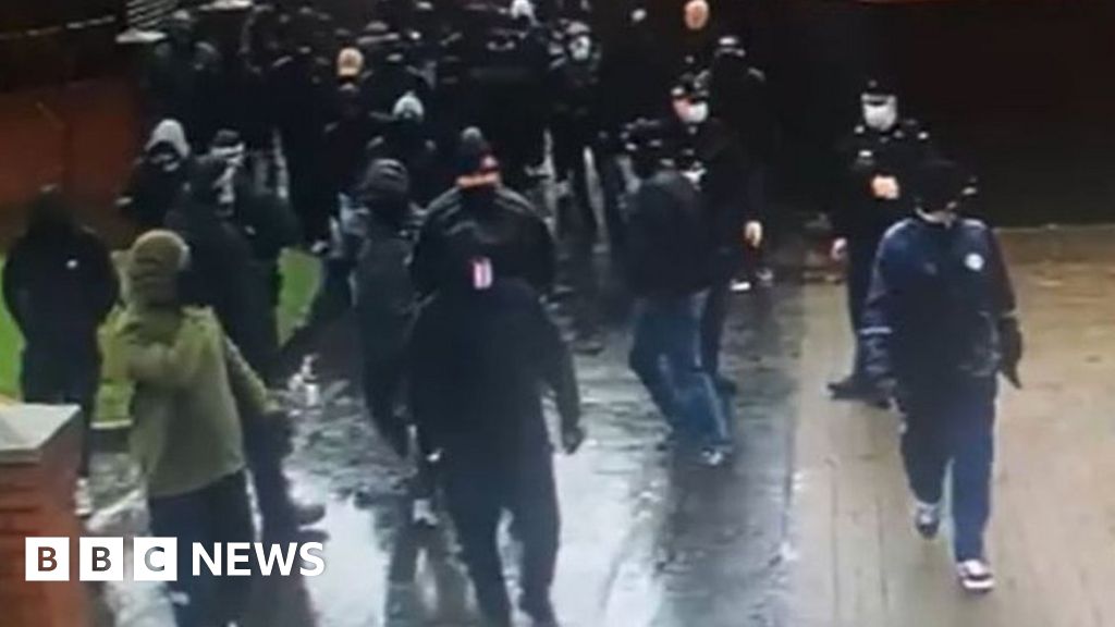 East Belfast: Arrests over masked crowd linked to UVF