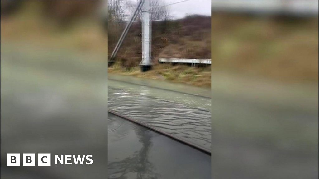 Railway lines have been closed and roads flooded after heavy rain - BBC ...