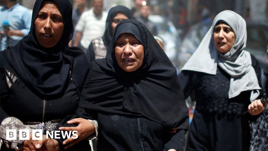Gaza begins to bury its dead after deadliest day in years - BBC News