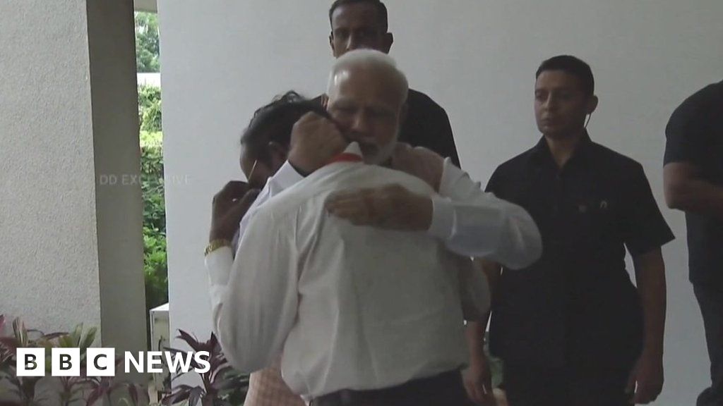 India PM Modi consoles scientists after Moon setback