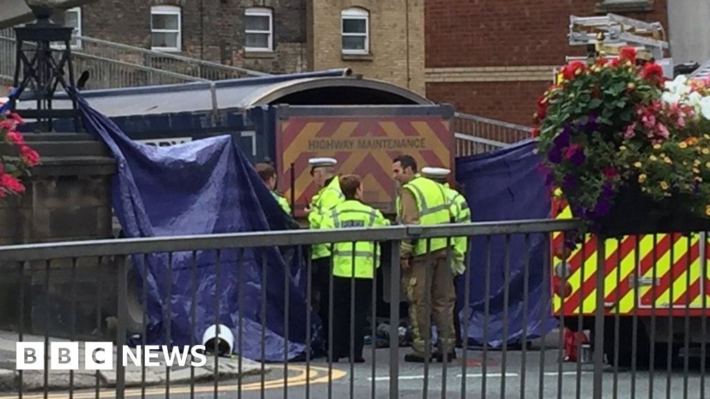Woman trapped under lorry in Lincoln city centre - BBC News
