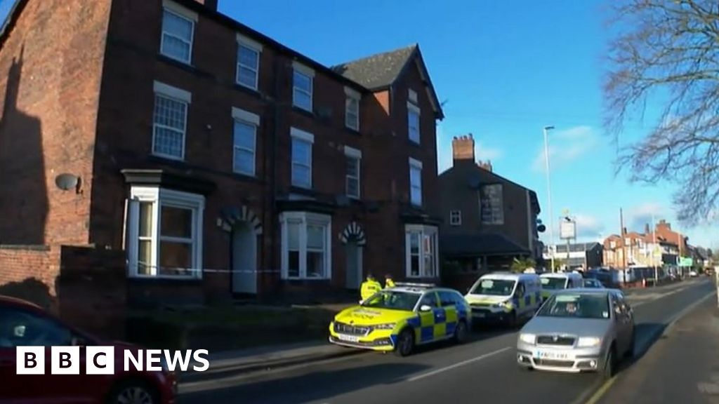 Man charged with murder after woman's body found in Stafford flat - BBC News