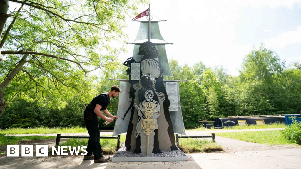 Racist graffiti defaces Birmingham black history sculpture - BBC News
