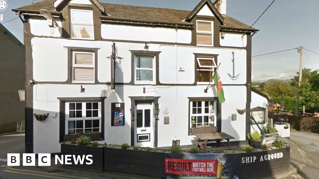 Holyhead Coastguard find man in pub after helicopter search - BBC News