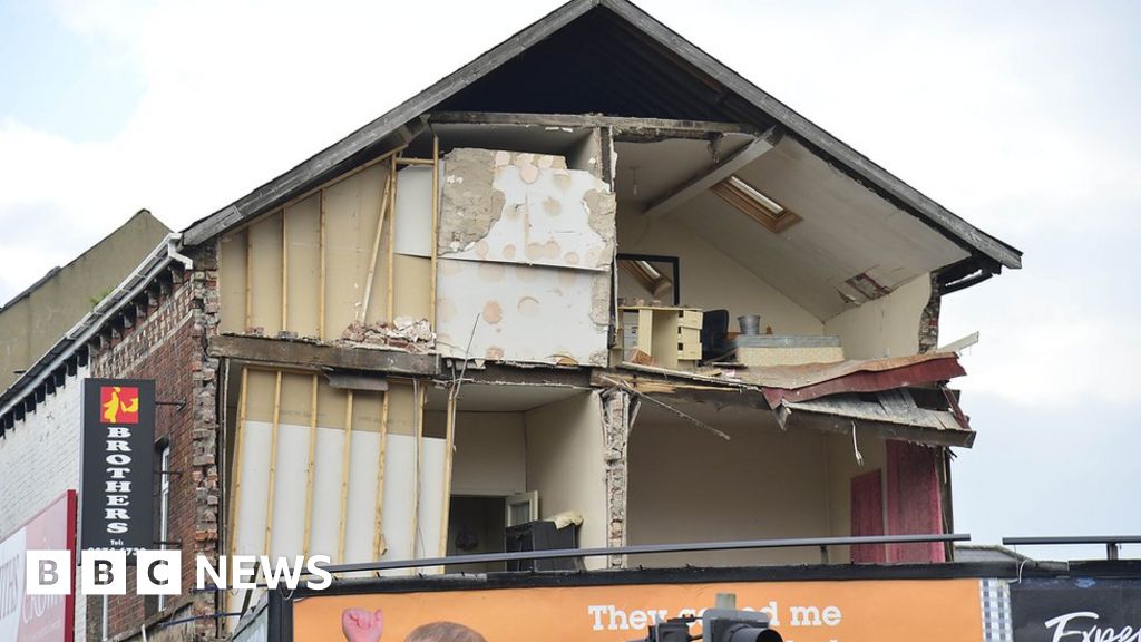 North Belfast: Collapsed wall on building closes Antrim road - BBC News