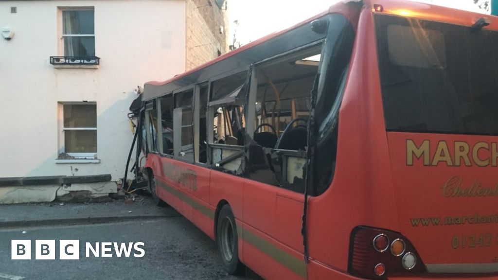 Four people hurt as bus crashes into house in Prestbury - BBC News