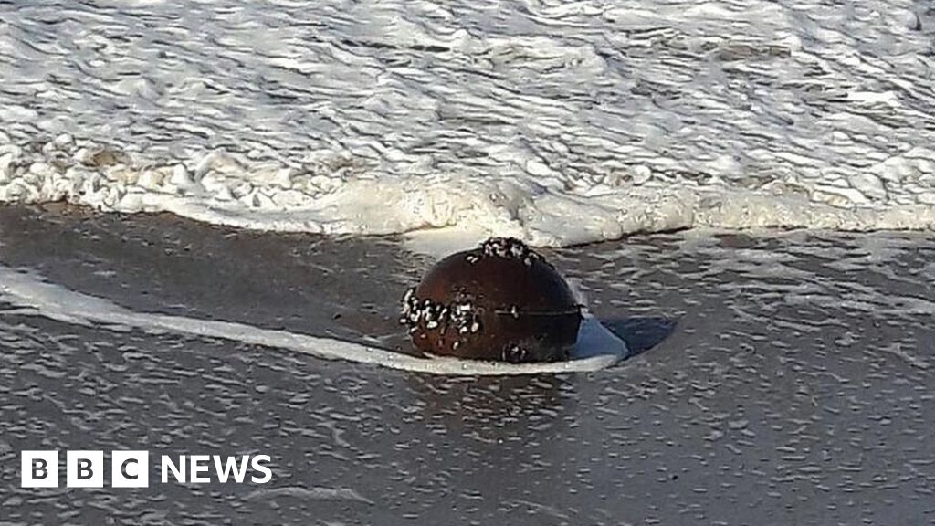 Homes evacuated as WW2 mine washes up on beach - BBC News