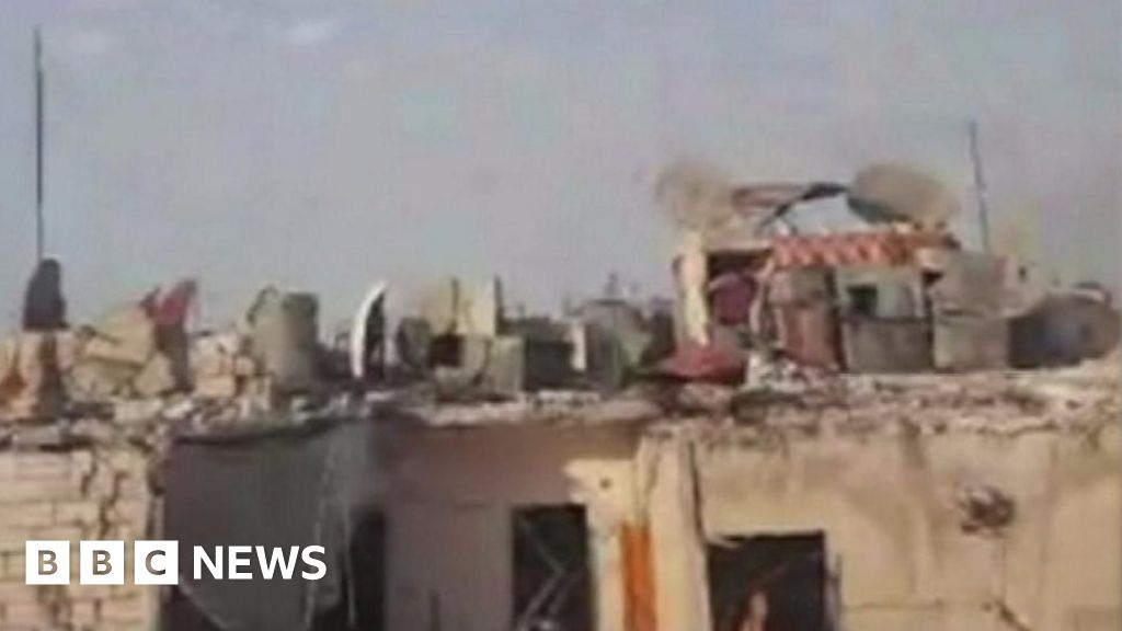 Aleppo: Mother films bombing from rooftop - BBC News