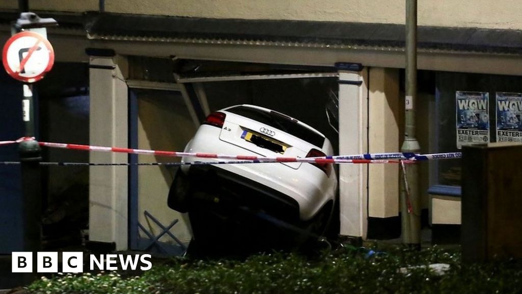 Audi car crashes through shop window in Tiverton - BBC News
