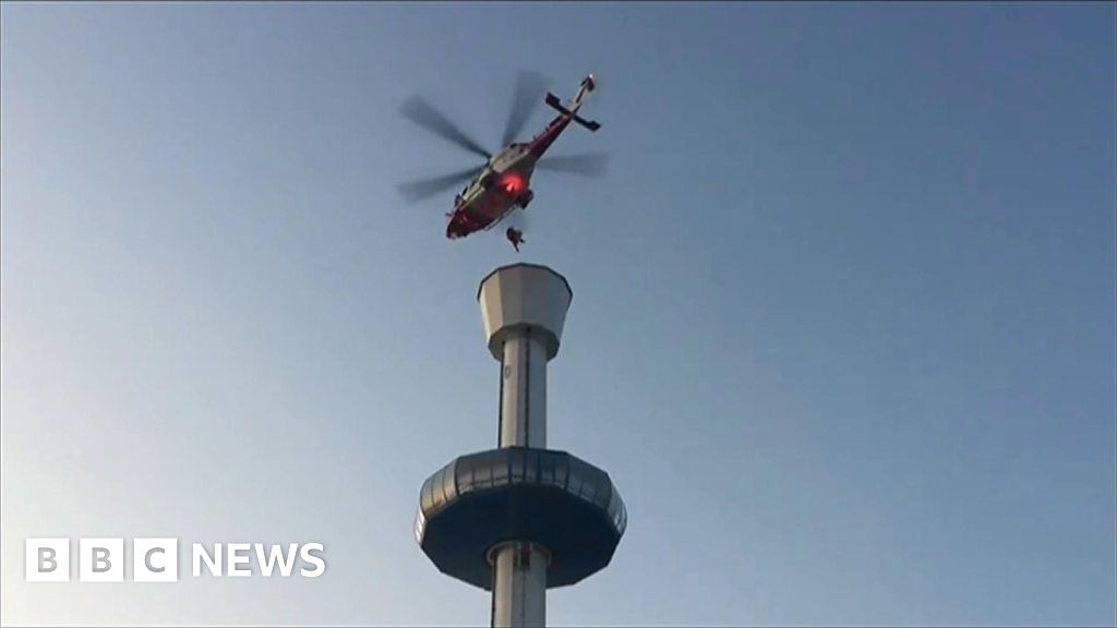 Tower visitors winched to safety after technical fault - BBC News