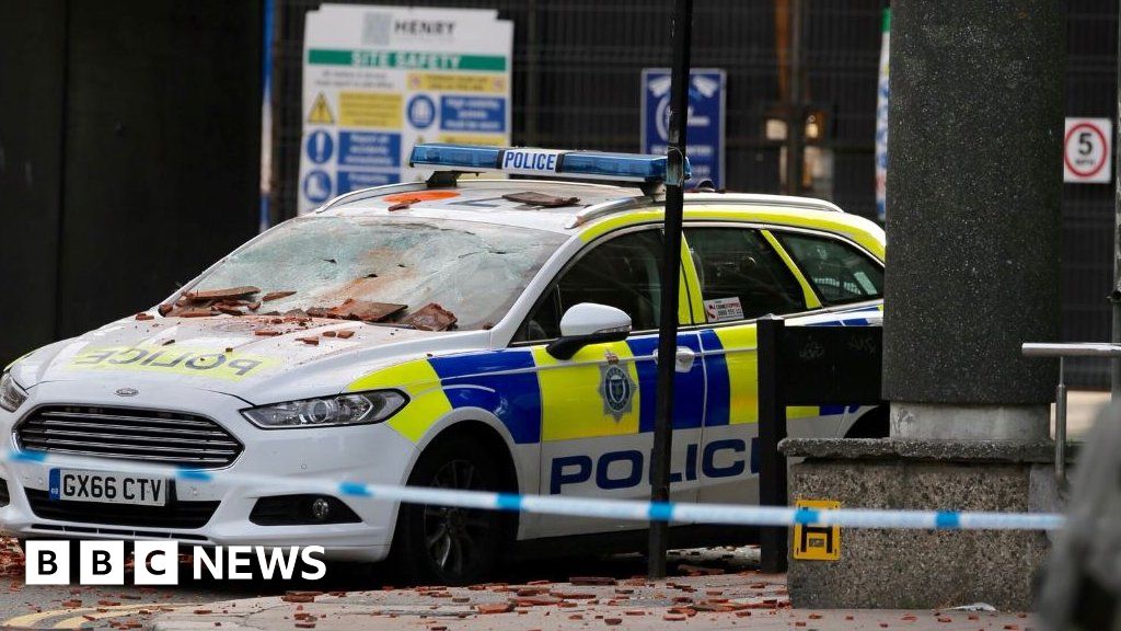 Brighton police cars damaged by man throwing tiles from roof