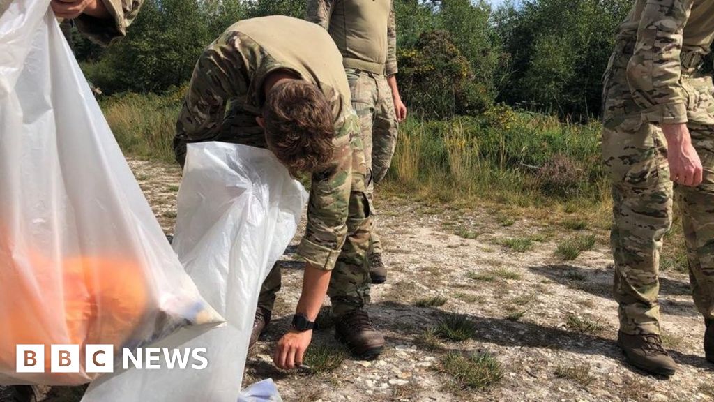 Marines clear litter from training area - BBC News