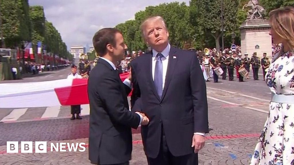 Trump and Macron share never-ending handshake at Paris parade