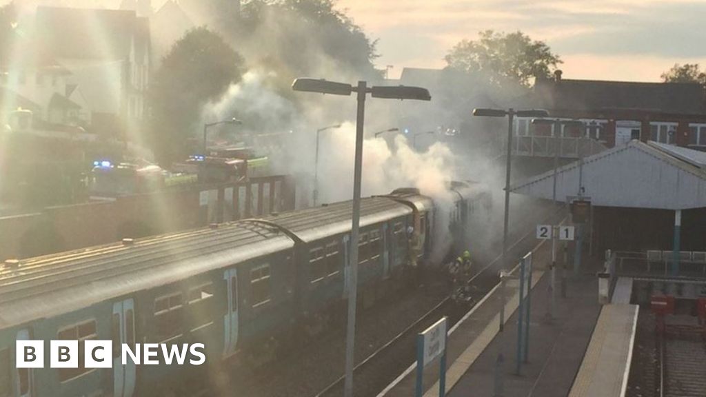 Caerphilly train fire: Passengers evacuated at station - BBC News