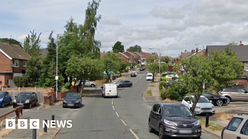 Men on motorbike left hand grenade in front of house in Bury