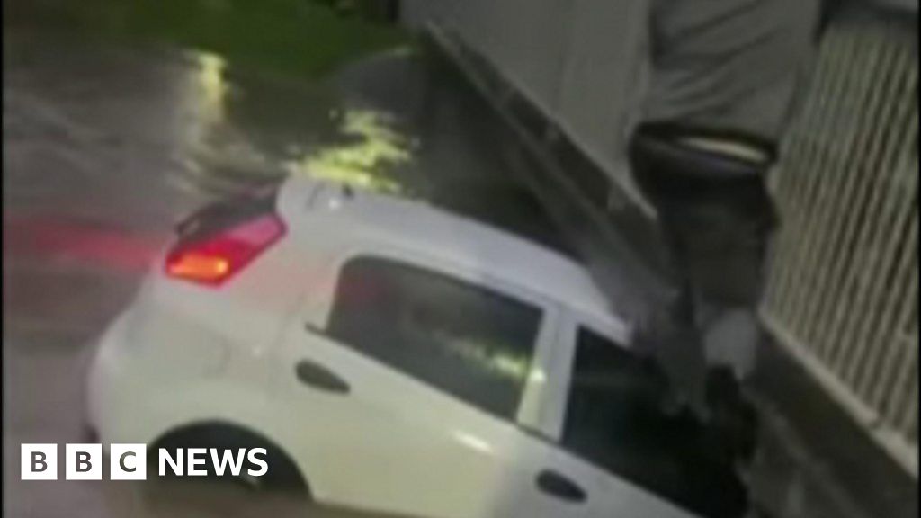Dramatic rescue of woman and child submerged in car in Birmingham ...