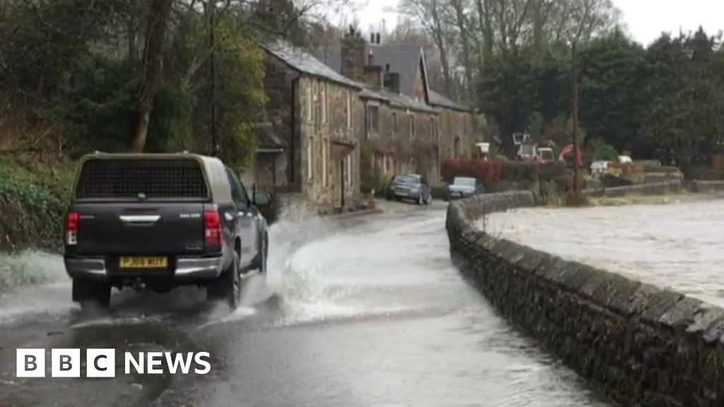 Rail services and roads hit by flooding - BBC News