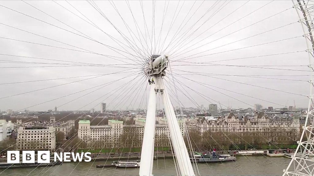 Watch: Don’t look down! BBC reporter paints London Eye - BBC News
