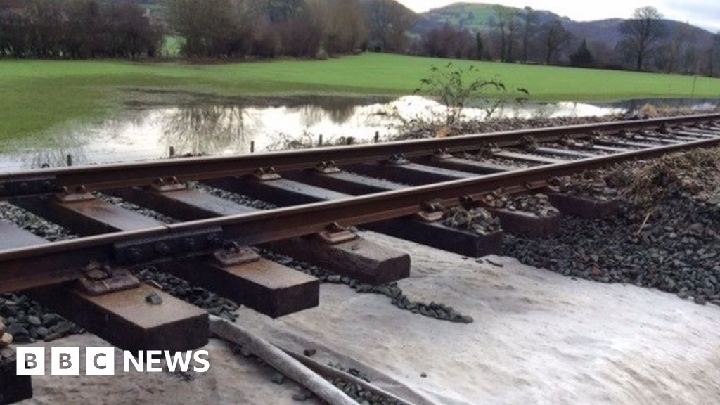 Conwy Valley rail line reopens after flood repairs - BBC News