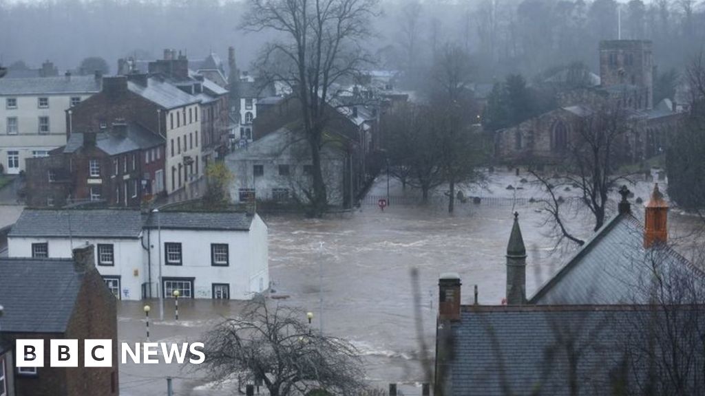 Search on for man in Kendal floodwater - BBC News