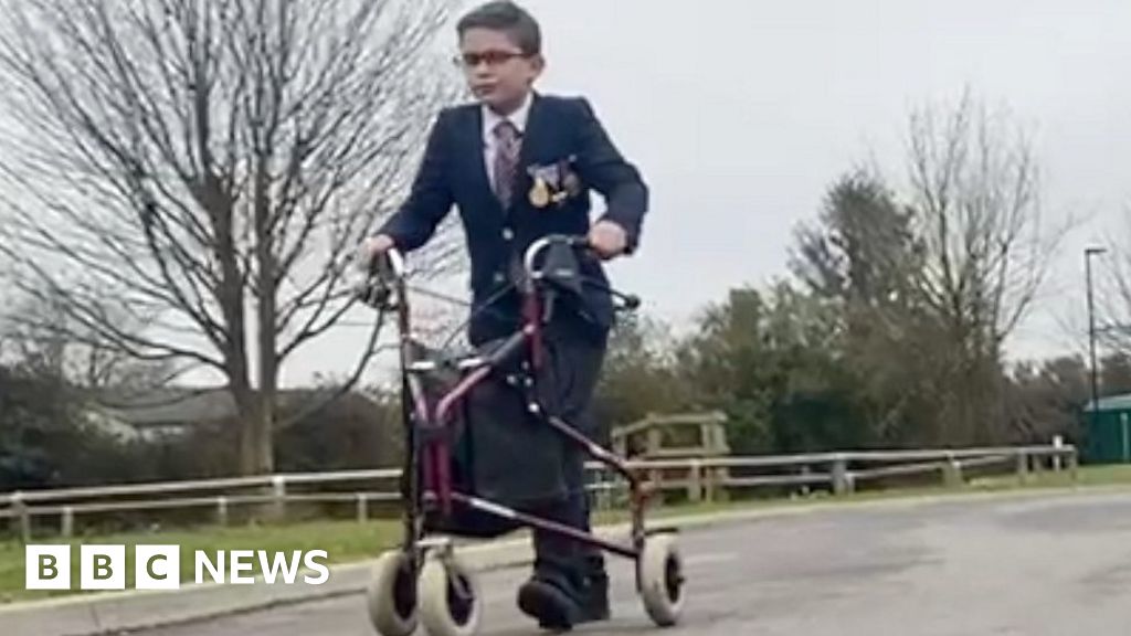 Captain Sir Tom Moore: Boy, 8, walks 100 laps of estate for NHS - BBC News